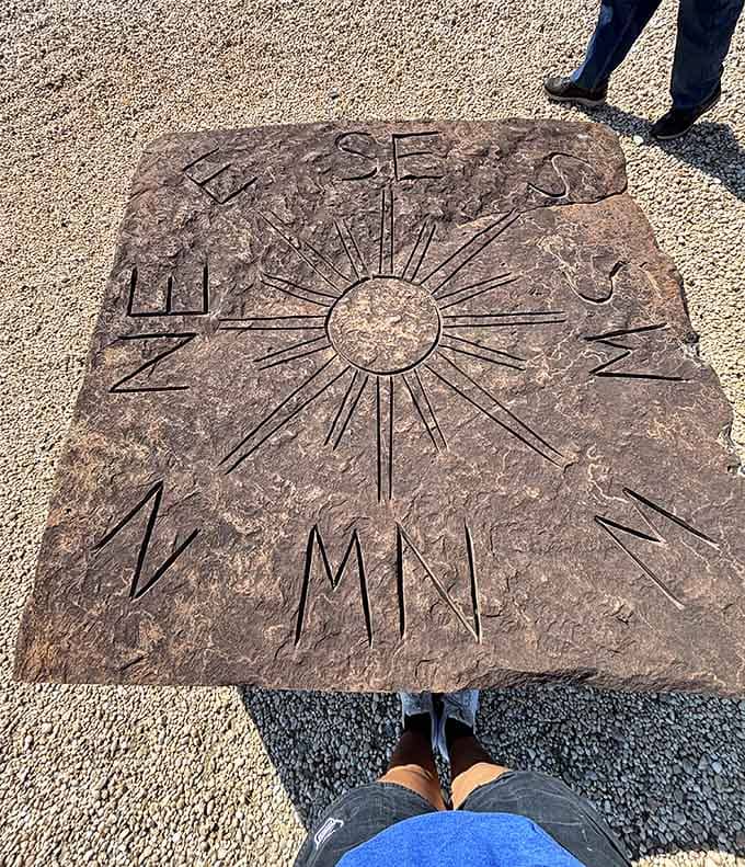 A compass carved right into the stone, because getting lost here is honestly part of the whole experience.