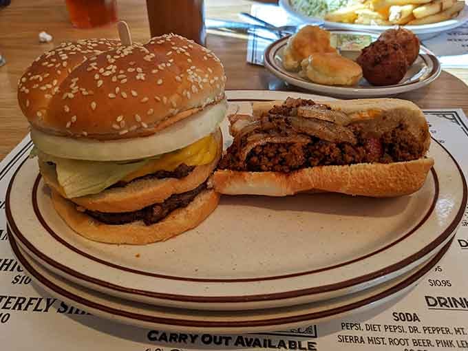 A double-patty burger and a chili dog sharing a plate, because sometimes one indulgence simply isn't enough and that's perfectly fine.