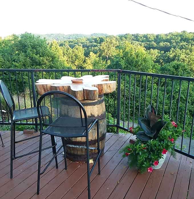 A barrel table, a wooden deck, and rolling Kentucky hills stretching as far as the eye can see.