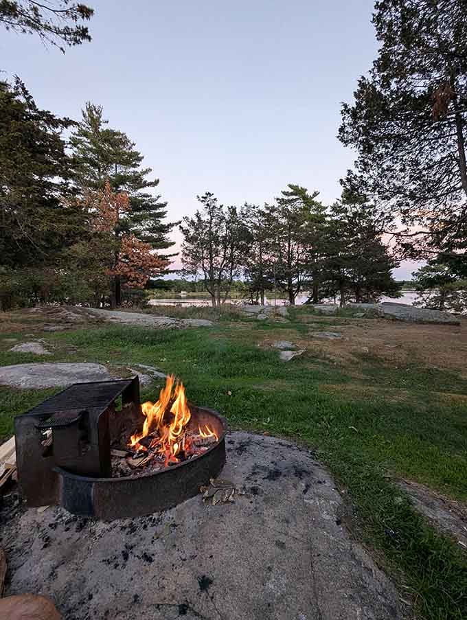 A crackling campfire, ancient granite underfoot, and the soft glow of dusk settling over the river islands. This is what unplugging actually looks like.