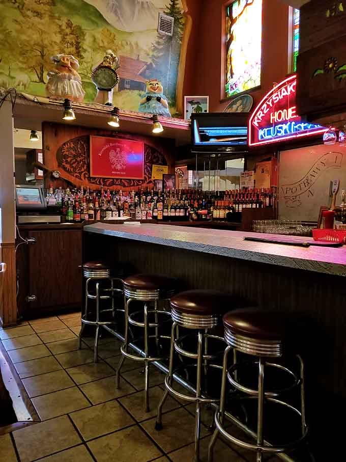 Classic bar stools, neon glow, and a back bar stocked like it means business. Pull up a seat and stay awhile.