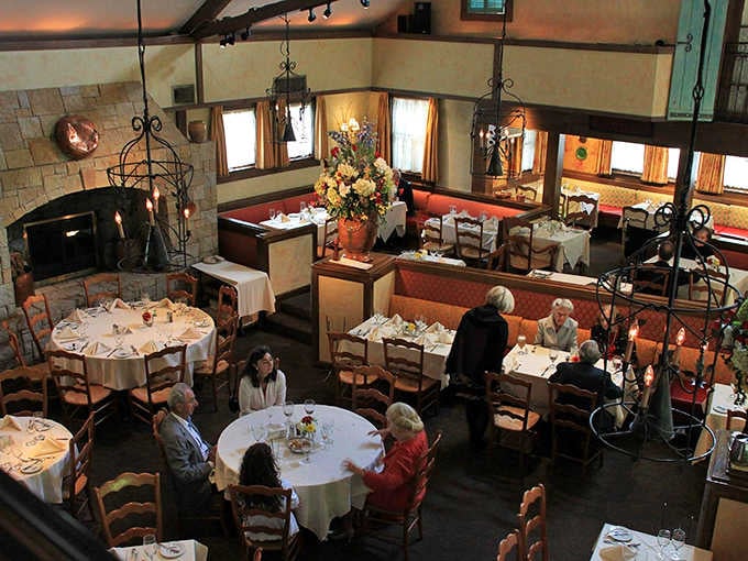 From above, the dining room tells the whole story. Stone fireplace, warm light, good company, and tables full of happy people.