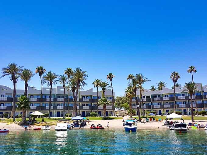 Waterfront resort living with palm trees, sandy beaches, and boats parked right outside. This is Arizona doing its best impression of paradise.