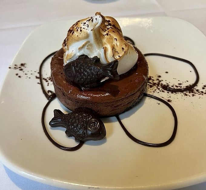 A chocolate cheesecake topped with torched meringue and tiny chocolate fish, because dessert should always have personality.