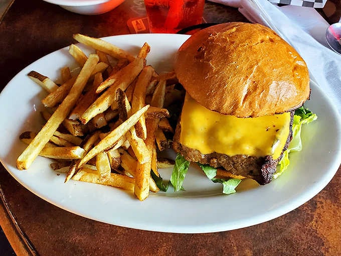 Lincoln's Roadhouse meatloaf cheeseburger arrives with house-cut fries, proving the kitchen handles American classics just as confidently as Cajun ones.