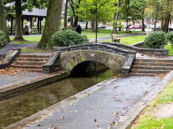 This stone arched bridge in Lititz Springs Park looks like it belongs in a storybook, and honestly, it does.