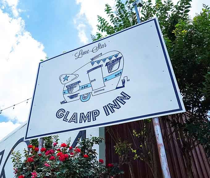 That roadside sign featuring a illustrated camper trailer is the kind of welcome that makes you slow down immediately.