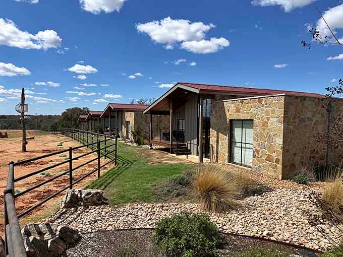 Stone-clad guest villas sit quietly along the Texas landscape, looking like they belong in a Hill Country dream you didn't want to wake from.
