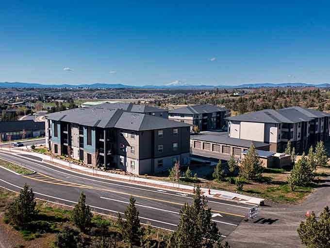 Modern apartments with Cascade mountain views in the background. Affordable living in Madras doesn't mean sacrificing the scenery.