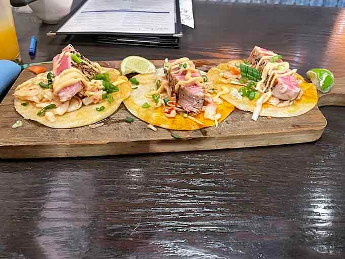 Seared ahi tuna tacos served on a wooden board, this dish travels far and lands somewhere wonderful.
