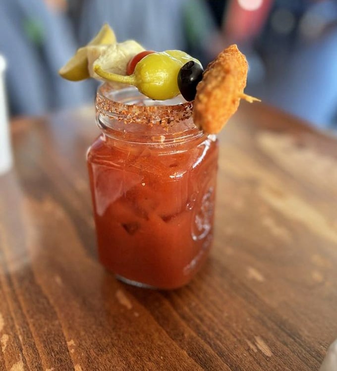 A Bloody Mary garnished so enthusiastically it's practically a meal, complete with enough toppings for a scavenger hunt.