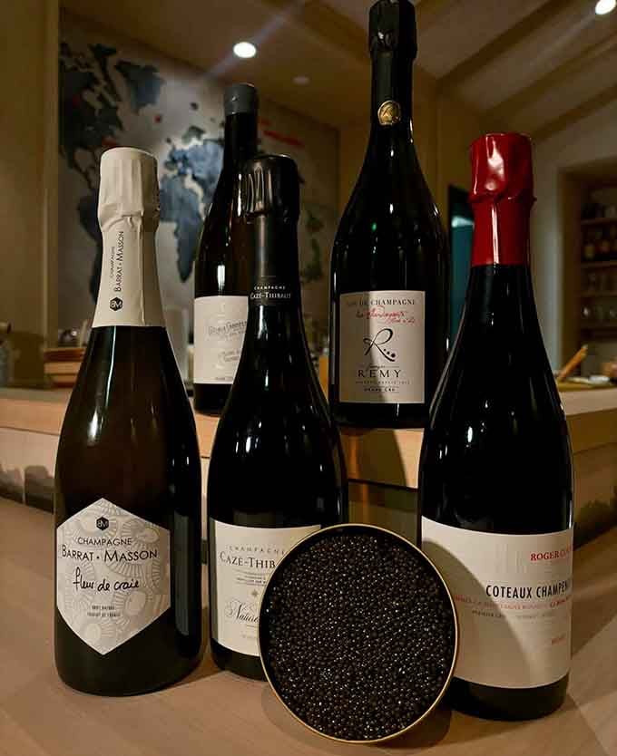 Champagne bottles flanking an open tin of caviar is a still life that would make any art museum seriously reconsider its collection priorities.