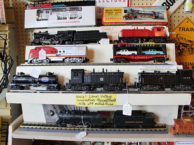 Reconditioned Lionel locomotives lined up for sale, still wearing their price tags like badges of honor from another era entirely.