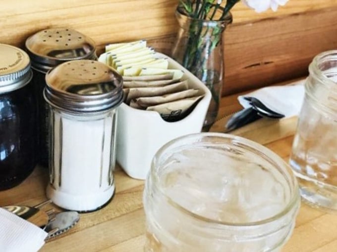 Simple table condiments in their natural habitat, ready to customize your breakfast experience to perfection exactly.