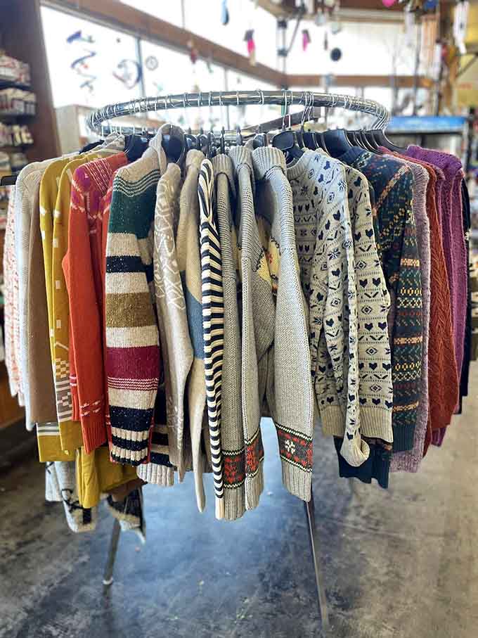 A rack of cozy, patterned sweaters that practically beg you to find a fireplace and a good book immediately.