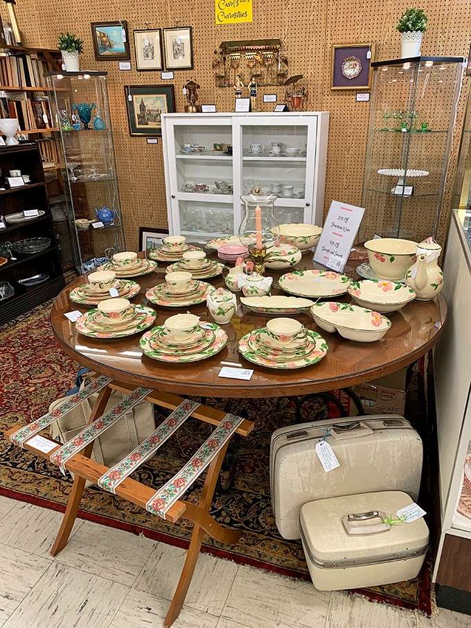 A full Franciscan Desert Rose dinnerware set spread across a round table, Sunday dinner just called and it wants its dishes back.