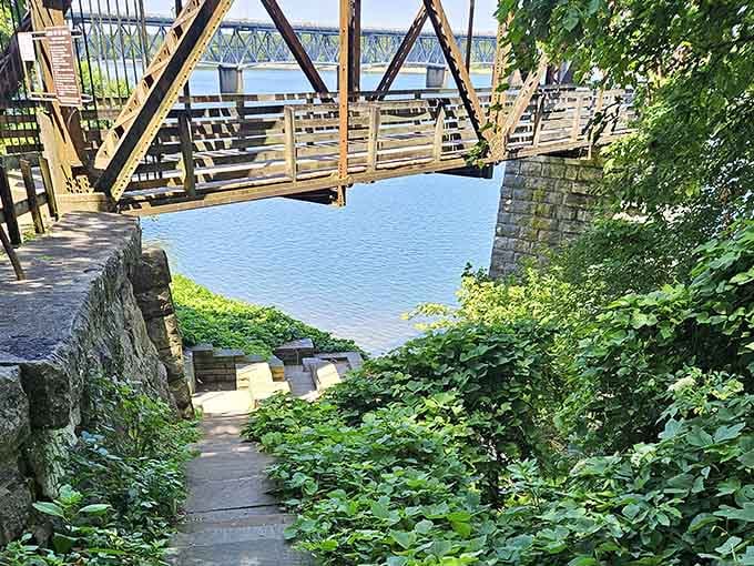 From the grassy bank, the old railroad bridge and the Tennessee River together create a view worth every single mile driven.