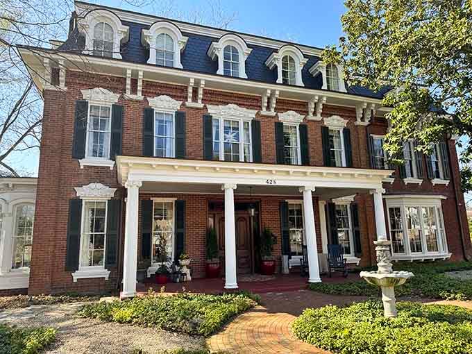 Grand columns, arched windows, and a fountain out front. This brick beauty means serious business.