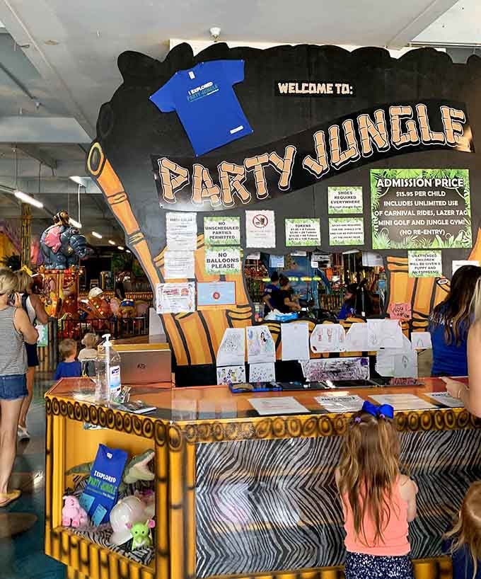The welcome desk sets the tone immediately. Jungle-themed, ticket-stocked, and ready for whatever chaos walks through the door.