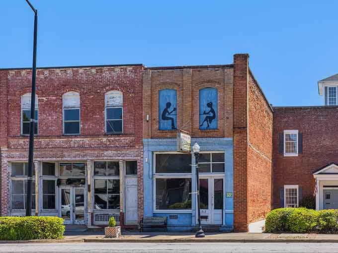 These weathered brick storefronts on Main Street carry decades of stories in every faded facade and arched window.
