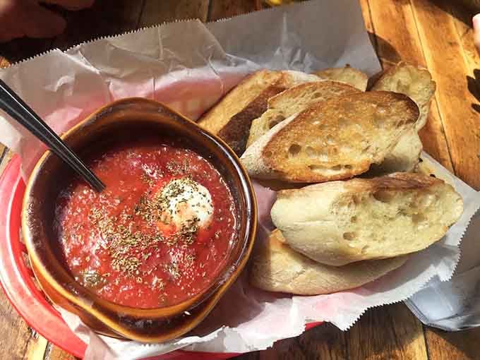 Goat cheese baked in house marinara, splashed with olive oil and oregano, served with warm bread. Pure, simple perfection.