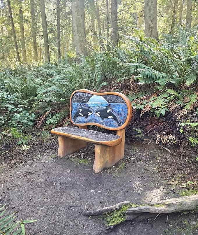 A hand-carved bench featuring two leaping orcas invites you to sit, rest, and appreciate the artistry surrounding you on all sides.