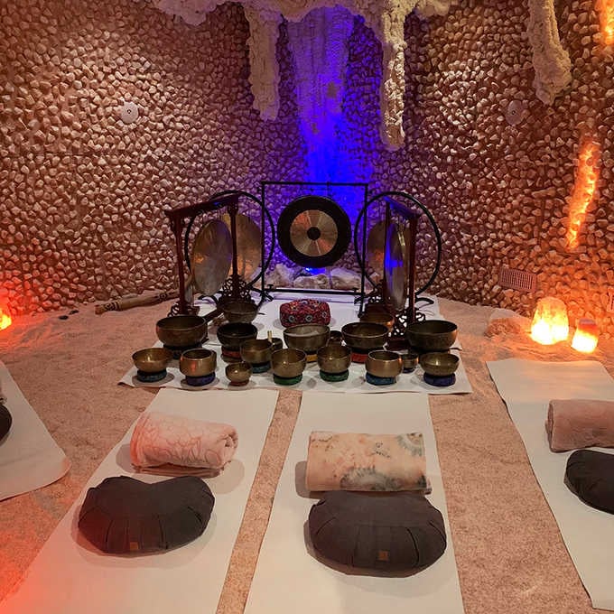 Sound healing setup with more bowls than your grandmother's china cabinet, but infinitely more therapeutic.