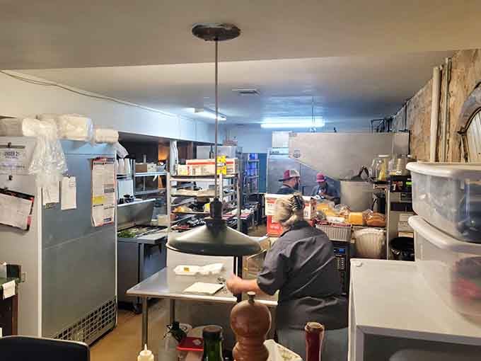 The kitchen crew works their magic in the underground space, turning out meals that keep locals coming back.
