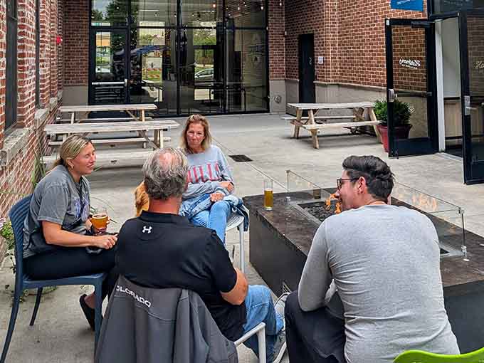 Friends gathering over cold beers on a perfect afternoon, which is basically the entire point of everything.
