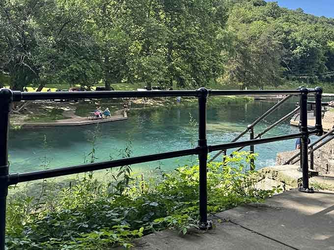 Black iron railings, turquoise water, and a view that makes you want to call someone and say, "You have to see this."