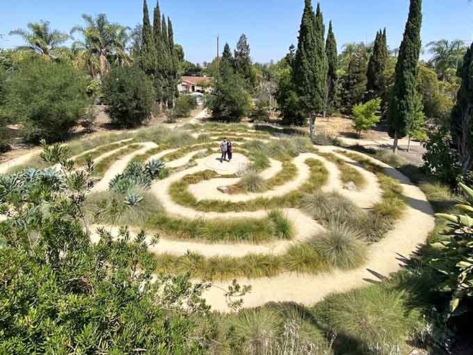 A peaceful labyrinth stretches across the grounds, inviting quiet reflection, because apparently ancient wisdom and a good walk go hand in hand.