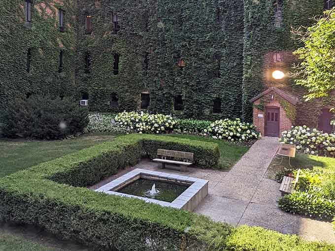 Even the gardens here look contemplative, as if the landscaping itself took a vow of peaceful coexistence with ivy-covered walls.
