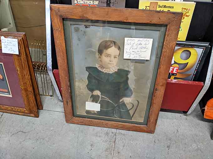 This vintage portrait captures a moment frozen in time, complete with period clothing and that serious expression everyone wore back then.