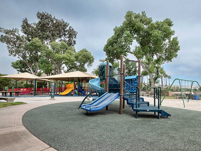 That colorful playground equipment means the grandkids stay entertained while you enjoy your lakeside coffee in peace.