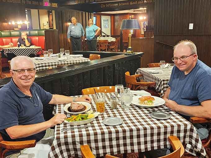 Two happy diners, two plates of prime rib, and zero regrets. This is what a good meal looks like.