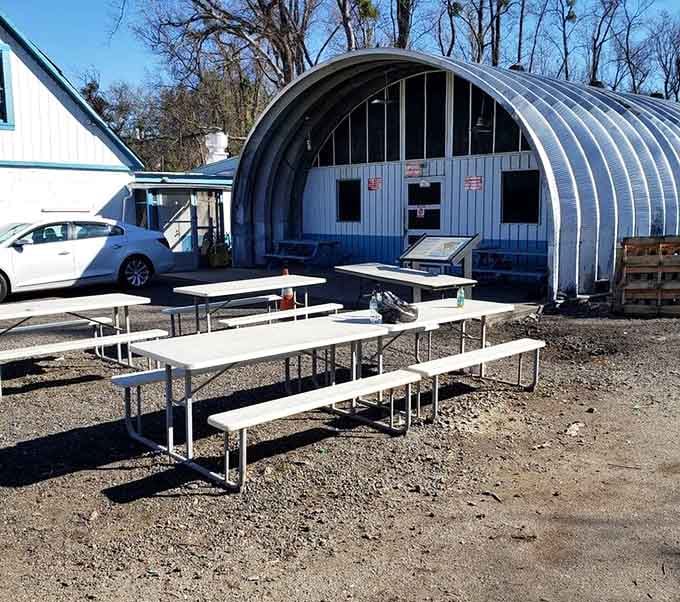 Picnic tables outside the smokehouse, proof that the best seats don't always require a reservation or a roof.