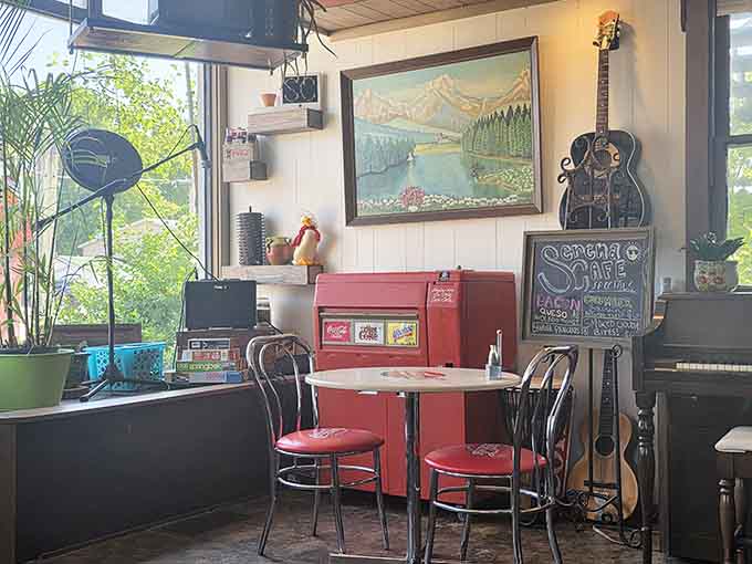 Guitars, landscape paintings, a vintage Coca-Cola cooler, and a chalkboard specials sign. Every corner tells a different story here.