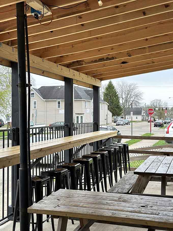 The covered patio offers fresh air, wooden benches, and a front-row seat to Springfield neighborhood life.