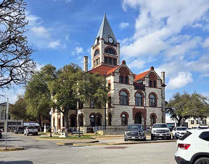 The Erath County Courthouse clock tower presides over the square like a proud grandfather who built everything you see.
