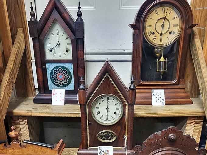 Three antique steeple clocks standing at attention, keeping time the old-fashioned way and looking absolutely magnificent doing it.