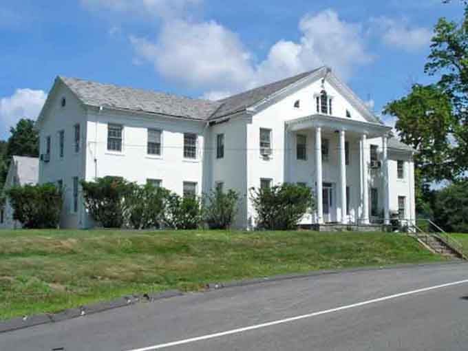 Grand white buildings like this one remind you that Storrs has layers of history worth slowing down to appreciate.