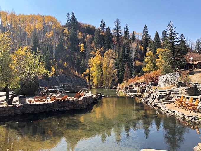 Fall color reflected perfectly in the still water, the kind of view that makes you want to call someone you love and describe it badly.