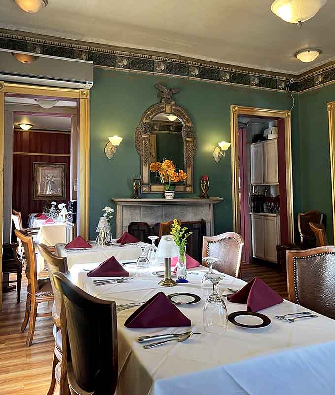 A fireplace, a gilded mirror, and burgundy napkins folded just so, this room has genuine old-world personality.
