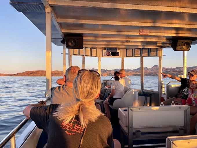 Golden hour on the water, with passengers pointing at scenery that genuinely earns the reaction.
