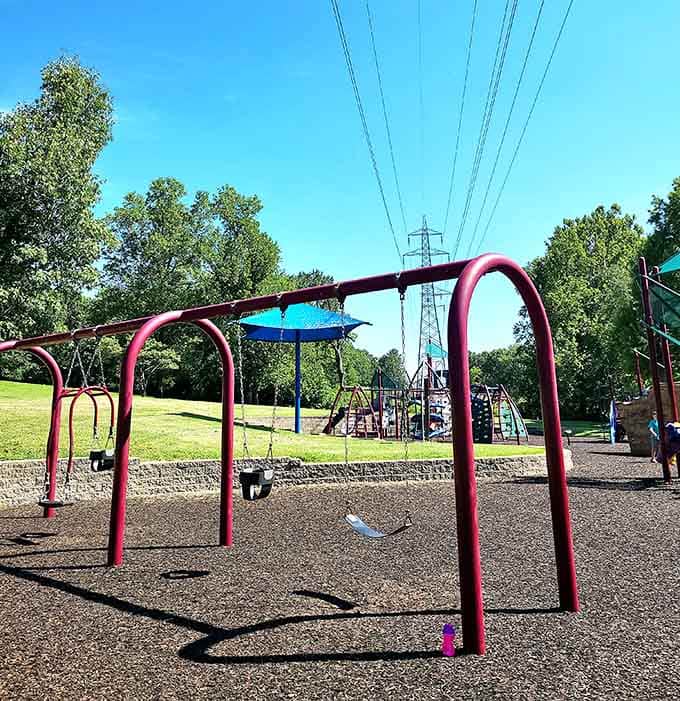 Swings with a view and rubber mulch underfoot. This playground means serious business, the fun kind.