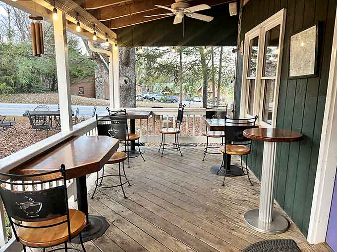 Wind chimes, bistro tables, and mountain air, this porch is the kind of place that turns a coffee break into a life decision.