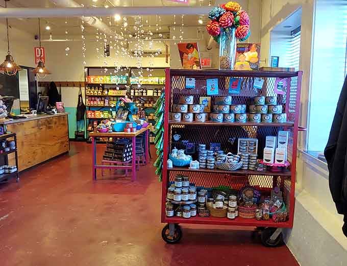 A rolling red display cart loaded with Taza goods anchors a store that somehow feels both artisan and welcoming.