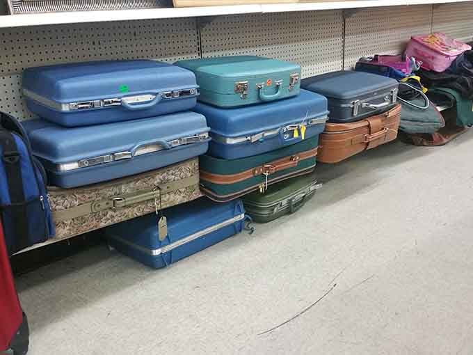 Vintage suitcases stacked and ready, each one carrying the quiet mystery of wherever it's already been.