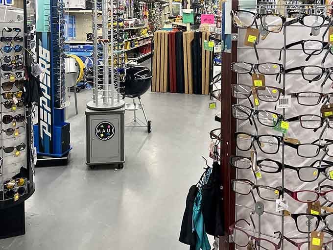 Sunglasses, reading glasses, and a kettle grill sharing the same aisle. The Big Store's version of organized chaos is genuinely charming.
