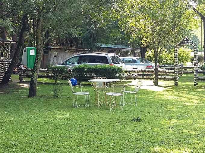 White iron chairs on green grass, surrounded by mugs and mountain air. Retirement goals, honestly.
